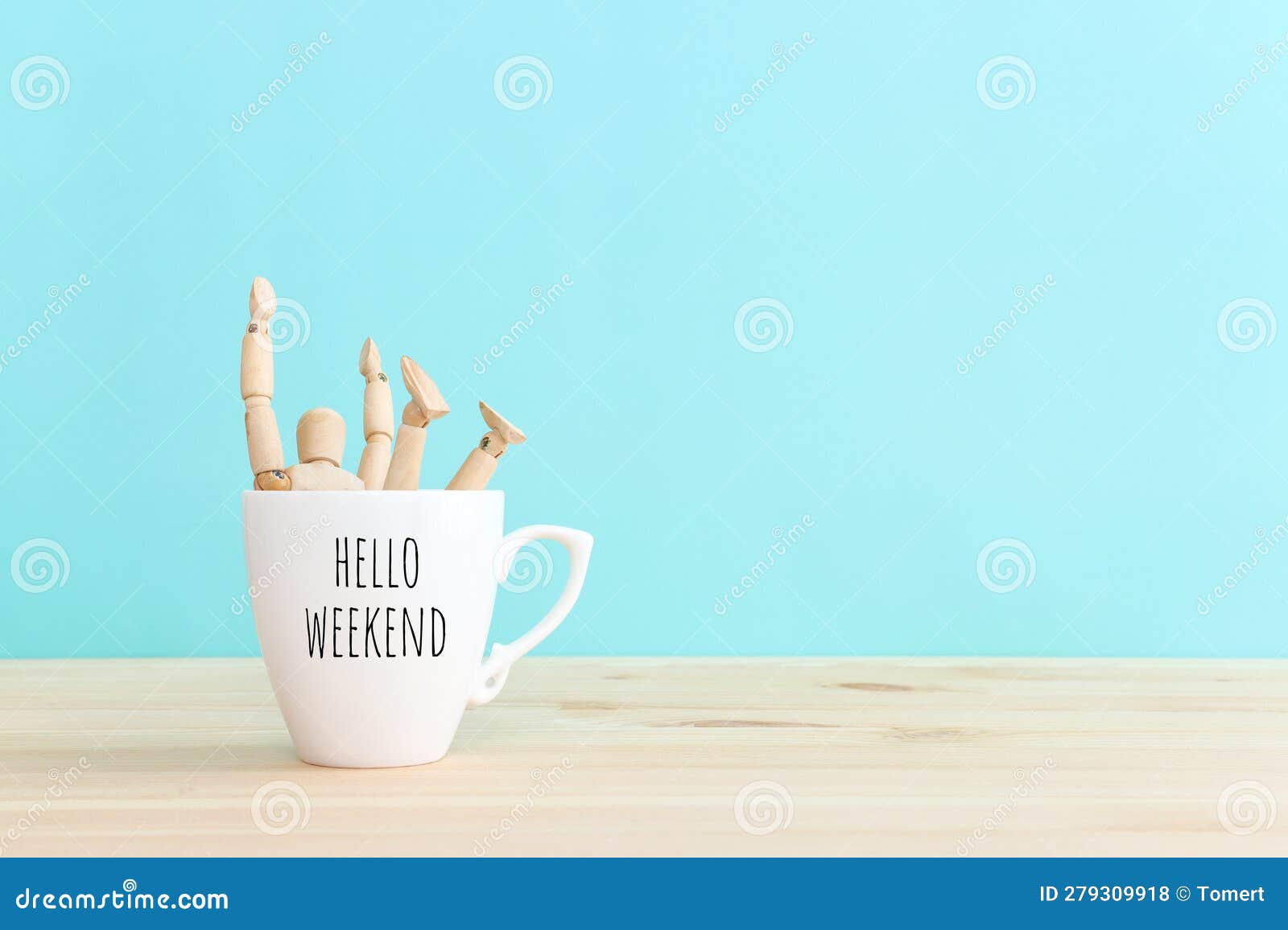 Wooden Figure Jumping from Coffee Mug with the Text Hello Weekend Stock ...