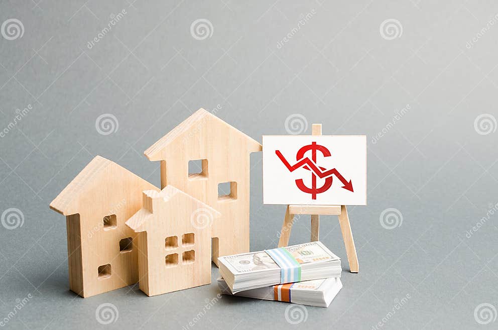 Wooden Figures of Houses and a Poster with a Symbol of Falling Value ...