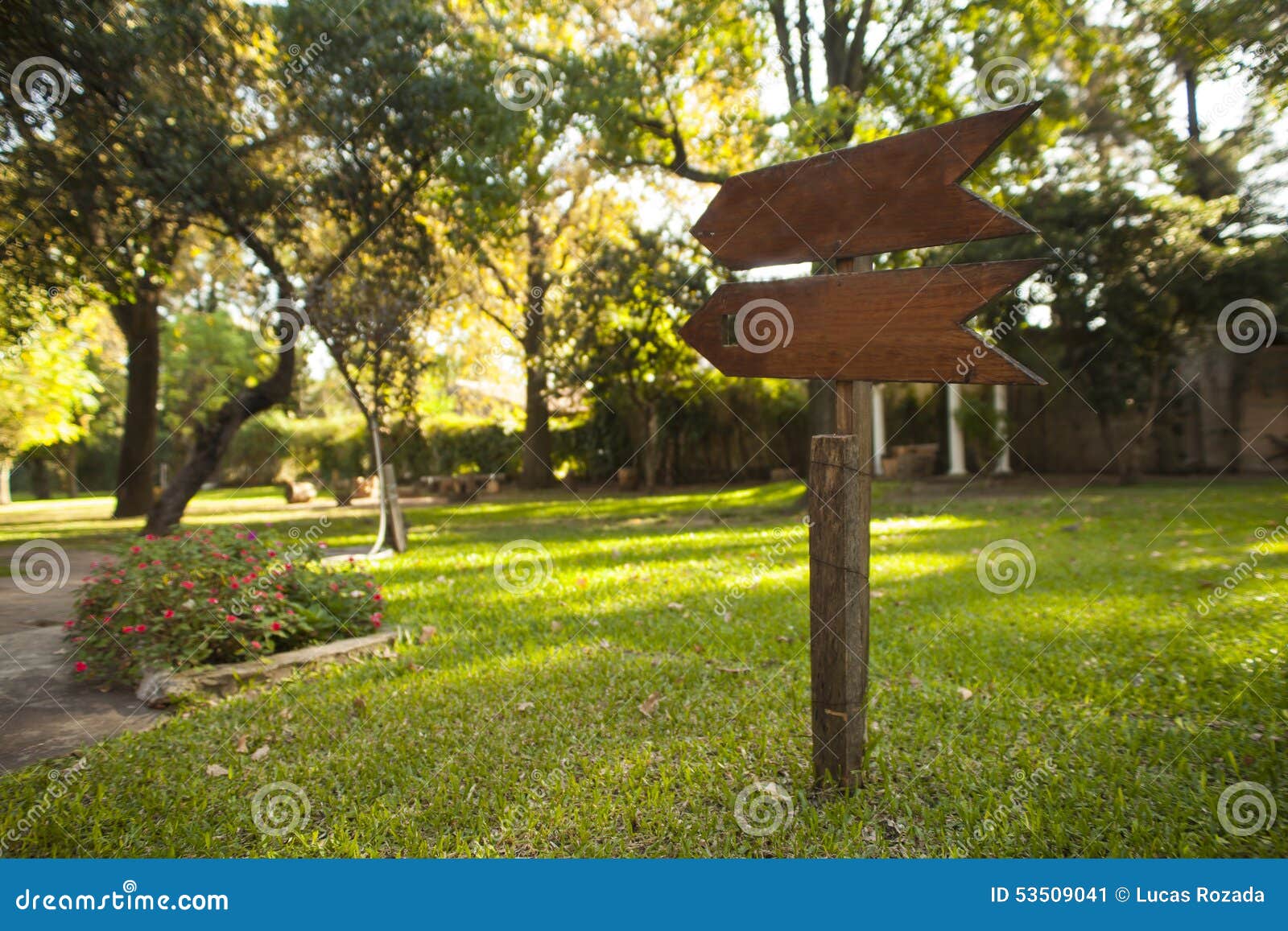 Wooden Garden Sign Pointing Down the Path Stock Image - Image of plank ...