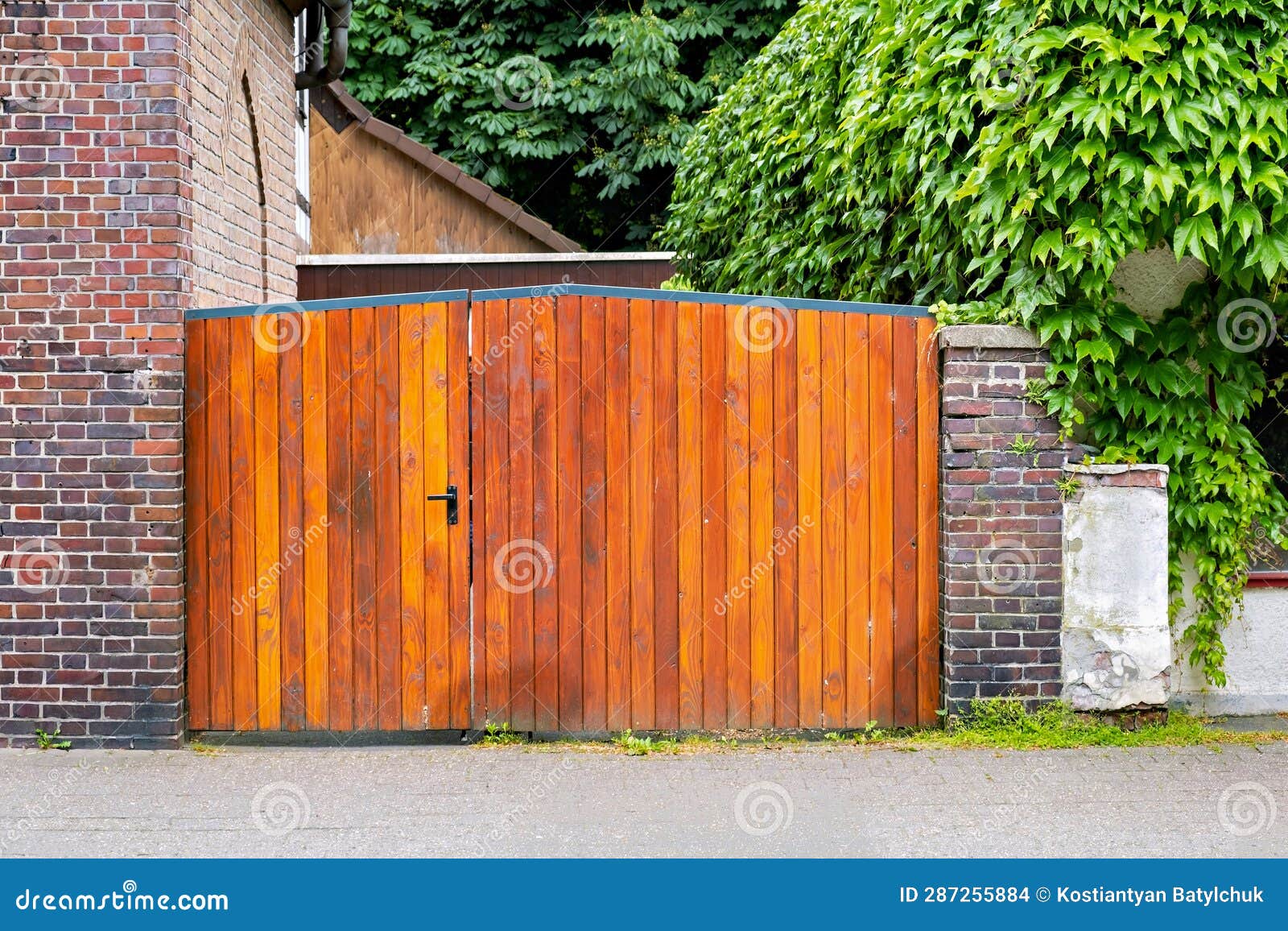 Wooden Gate in Front of Brick Building in Germany. Stock Photo - Image ...