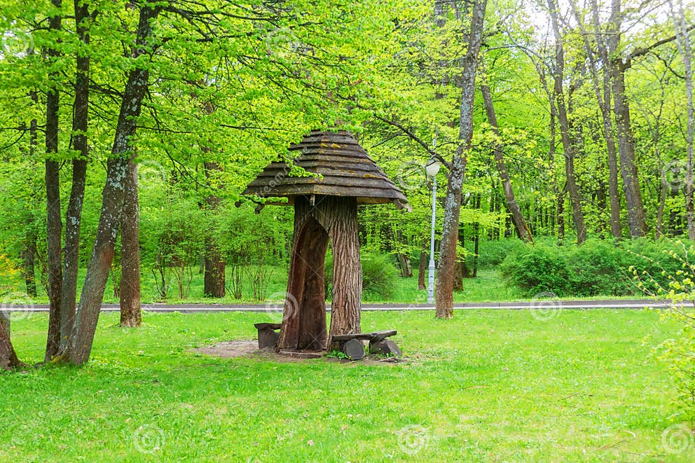 Wooden Gazebo in the Spring Forest Made in a Tree Trunk Stock Image ...