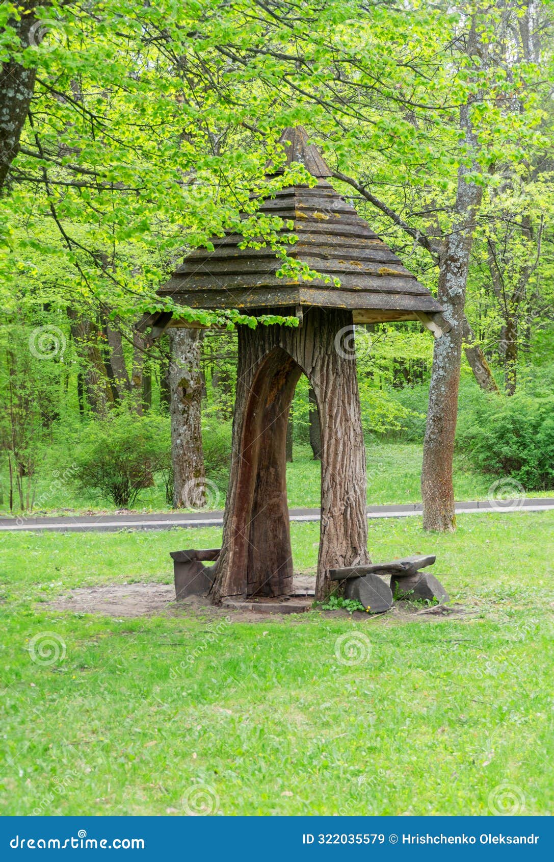 Wooden Gazebo in the Spring Forest Made in a Tree Trunk Stock Image ...