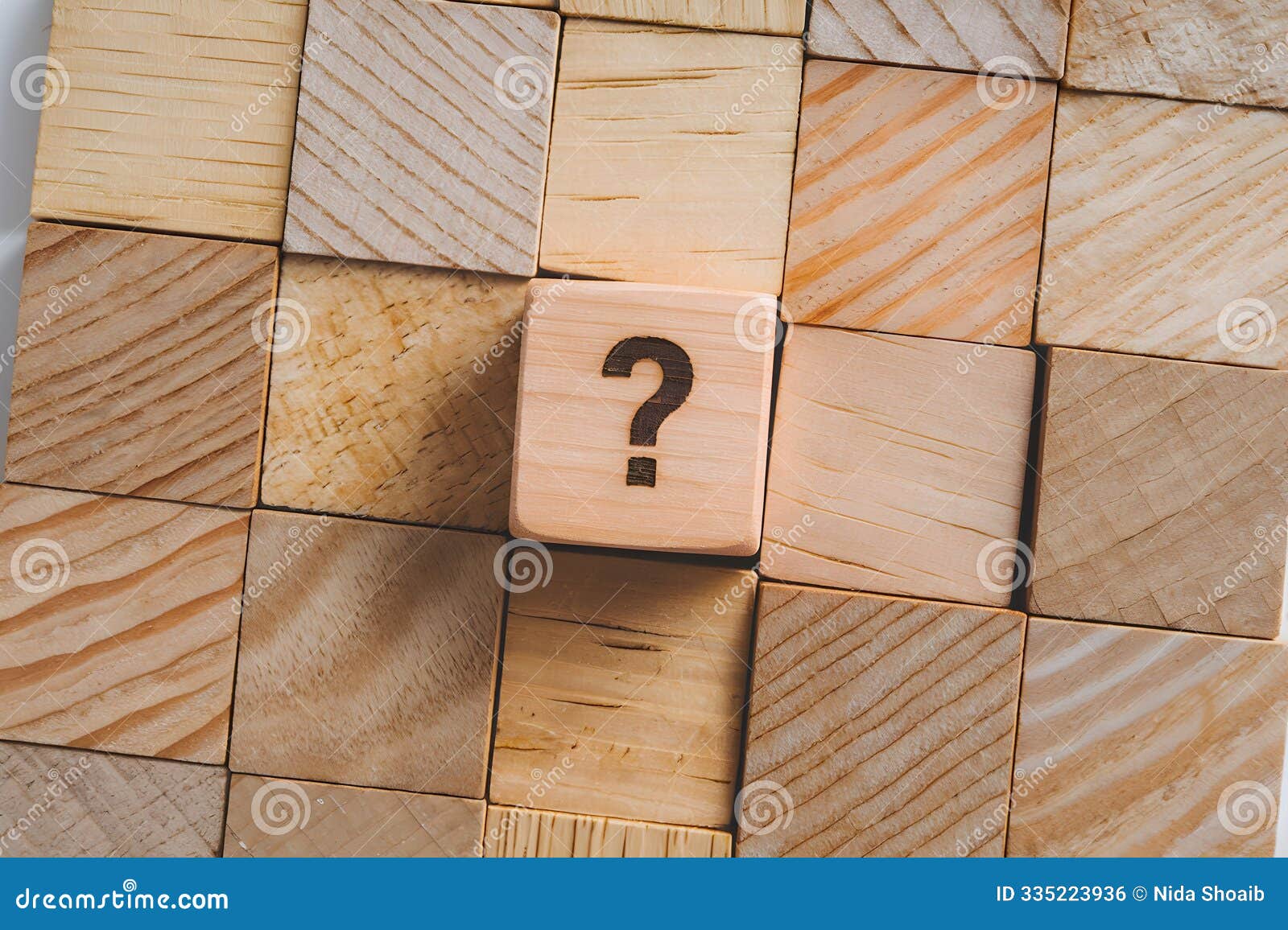 Wooden Grid with Standout Engraved Cube at Center Featuring a Question ...