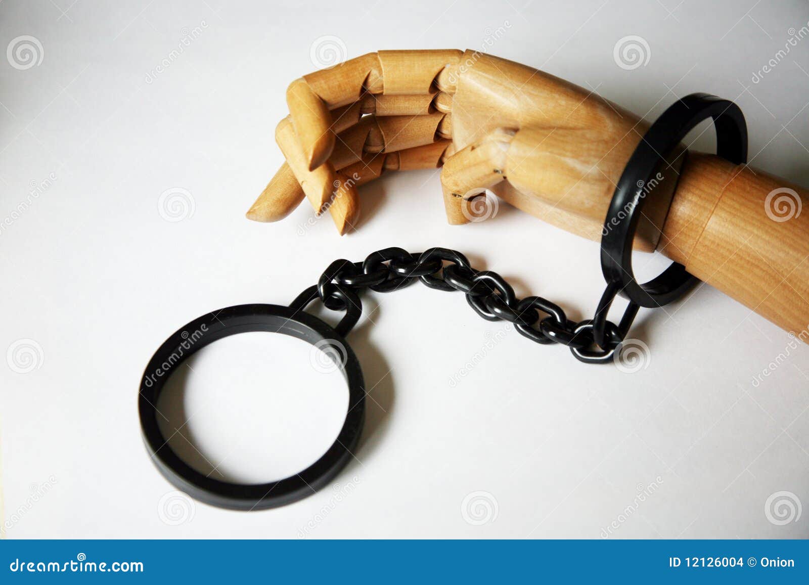 Wooden hand in handcuffs stock photo. Image of enforce - 12126004