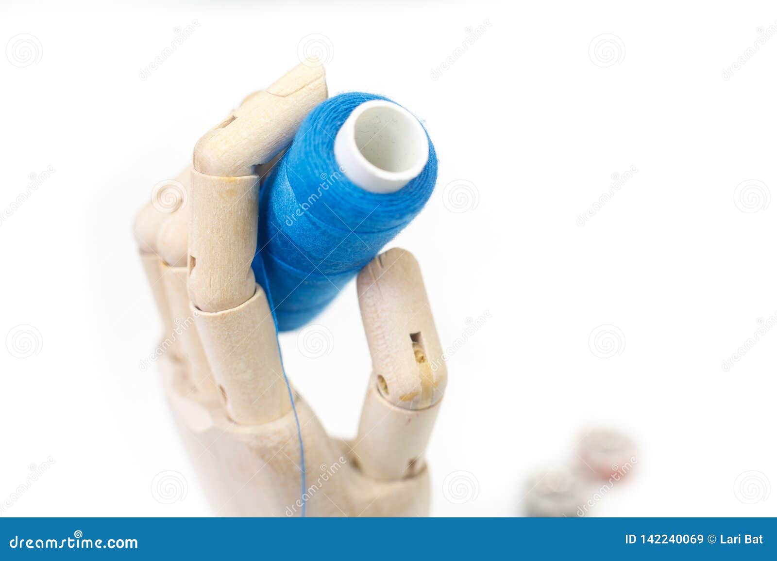 Wooden Hand is Holding a Coil of Blue Threads Stock Image - Image of ...
