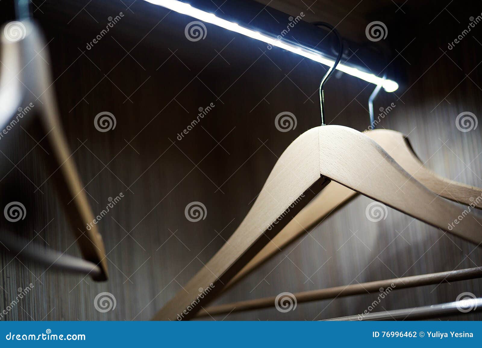 Wooden Hanger Hanging in an Empty Closet Stock Photo - Image of hanging ...