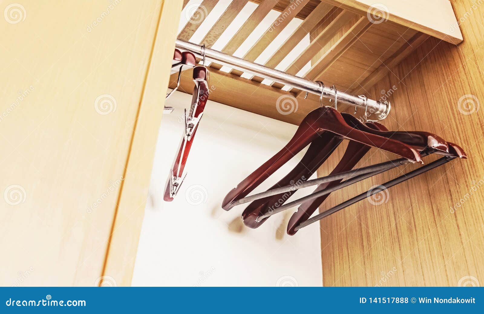 Hangers in the wardrobe stock photo. Image of wardrobe - 141517888