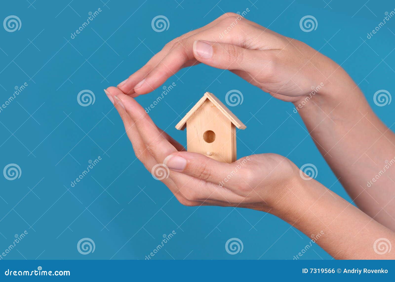 Wooden house on the hand stock photo. Image of invest - 7319566