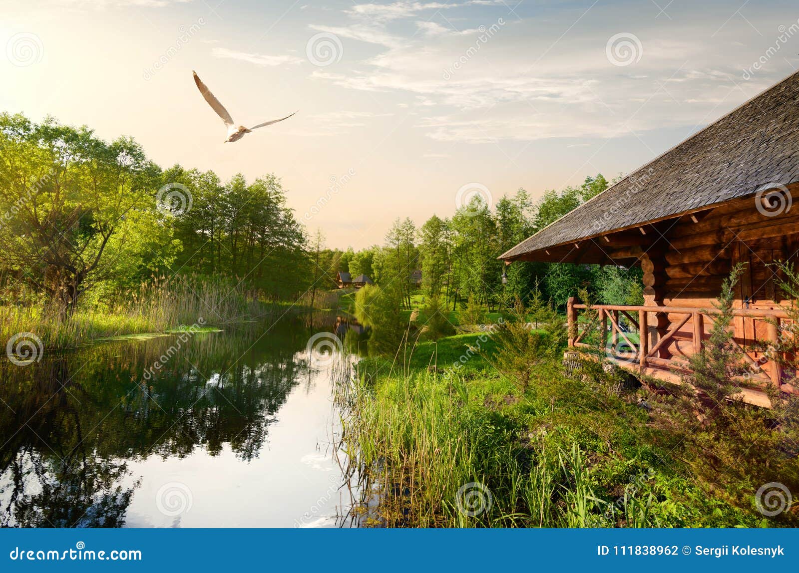 Wooden house at sunrise stock photo. Image of retro - 111838962