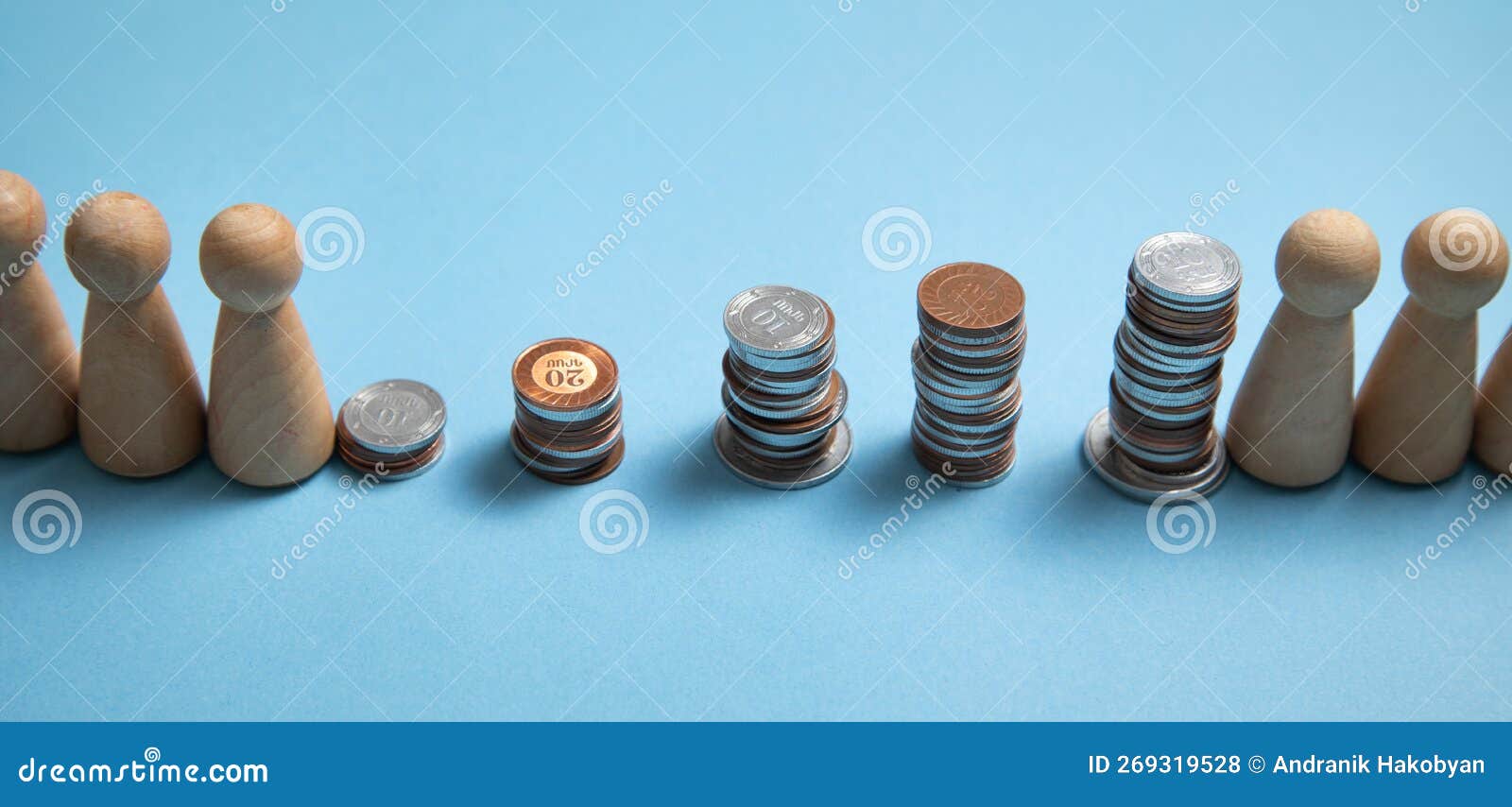 Wooden Human Figures with a Stack of Coins Stock Photo - Image of ...