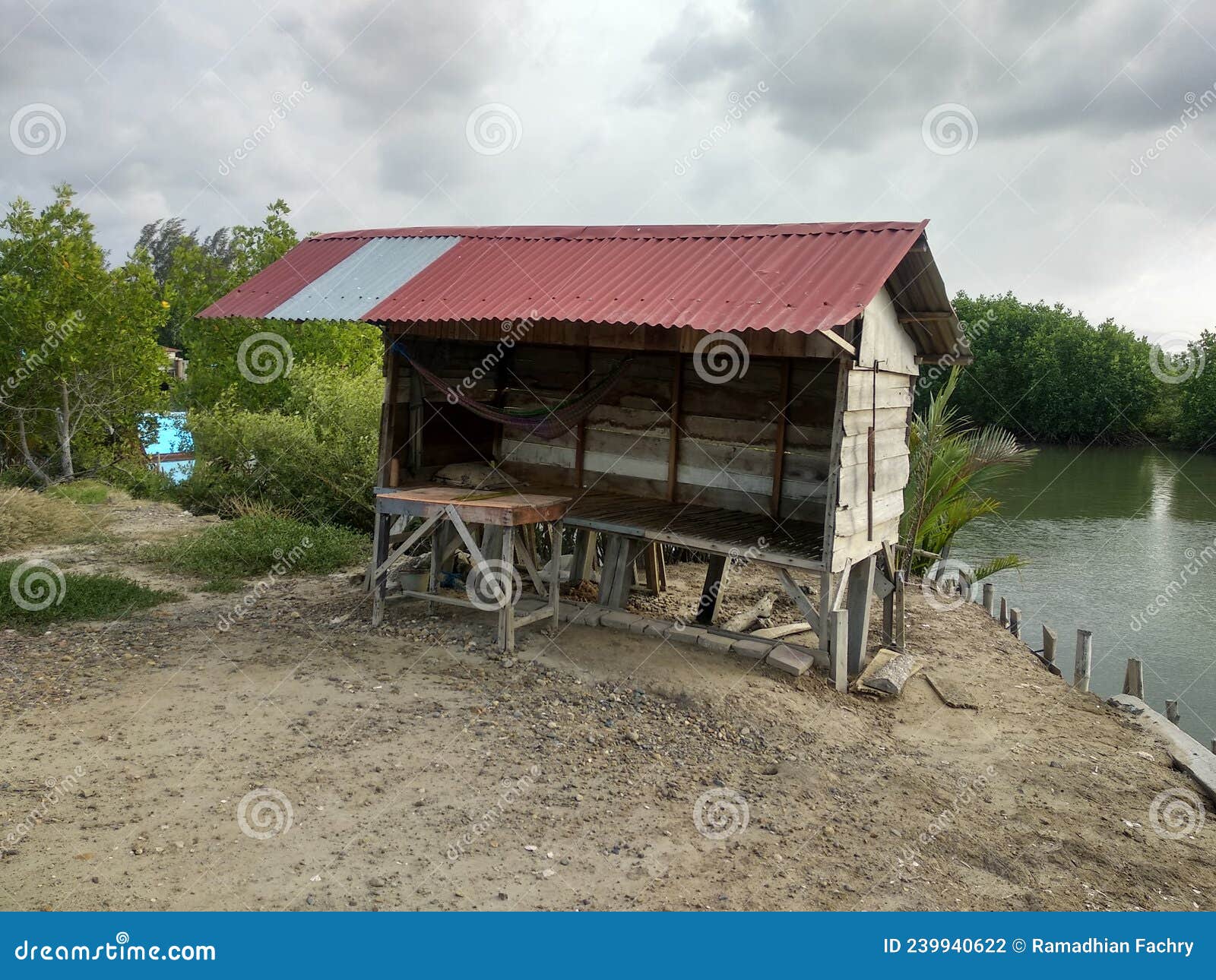 A Wooden Hut at the Side of River Stock Photo - Image of wood ...