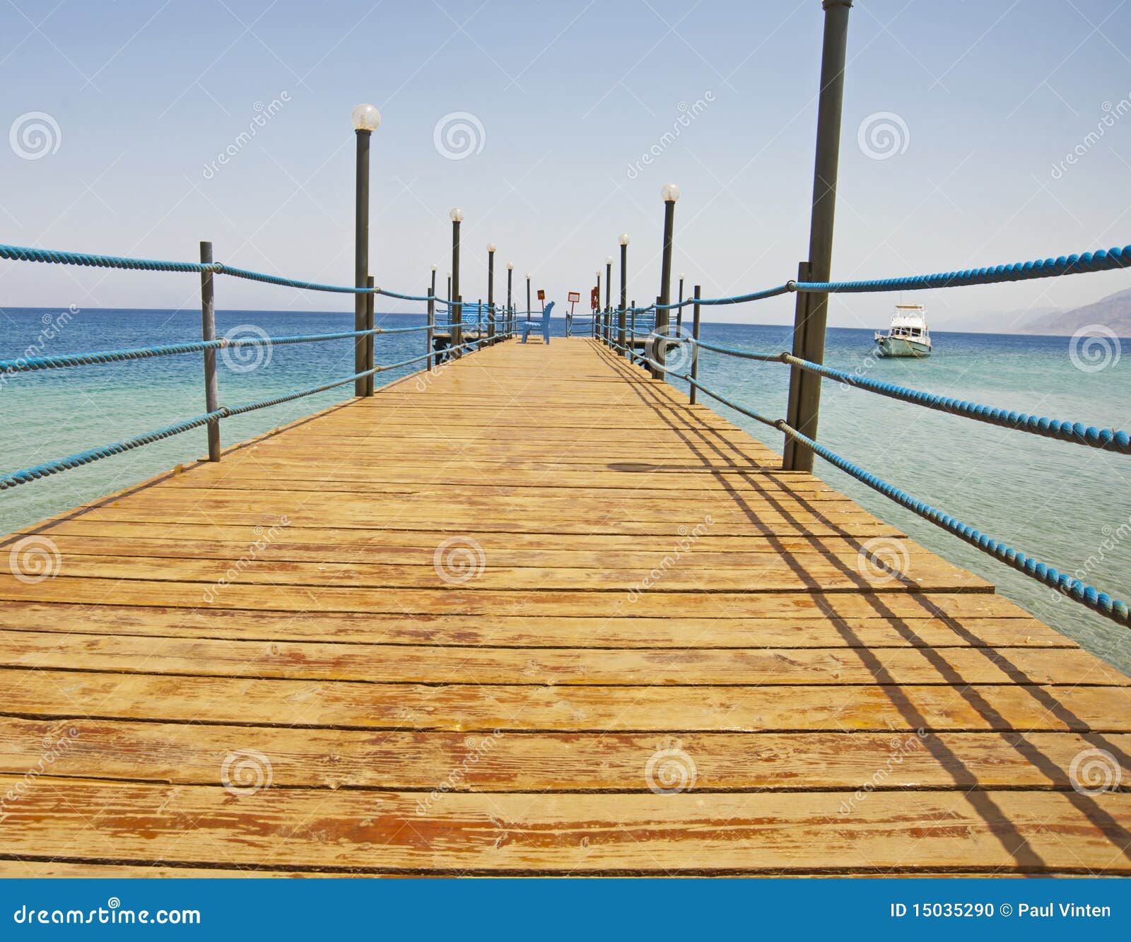 Wooden Jetty On A Tropical Beach Stock Photo - Image of jetty, distance ...