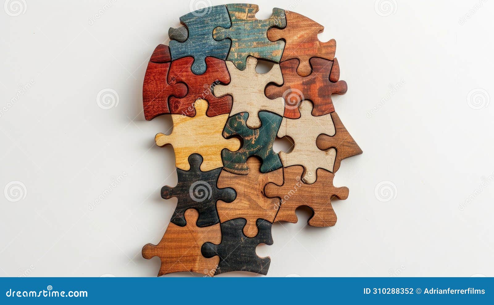 Wooden Jigsaw Puzzle Pieces Assembling into a Side Profile of a Human ...