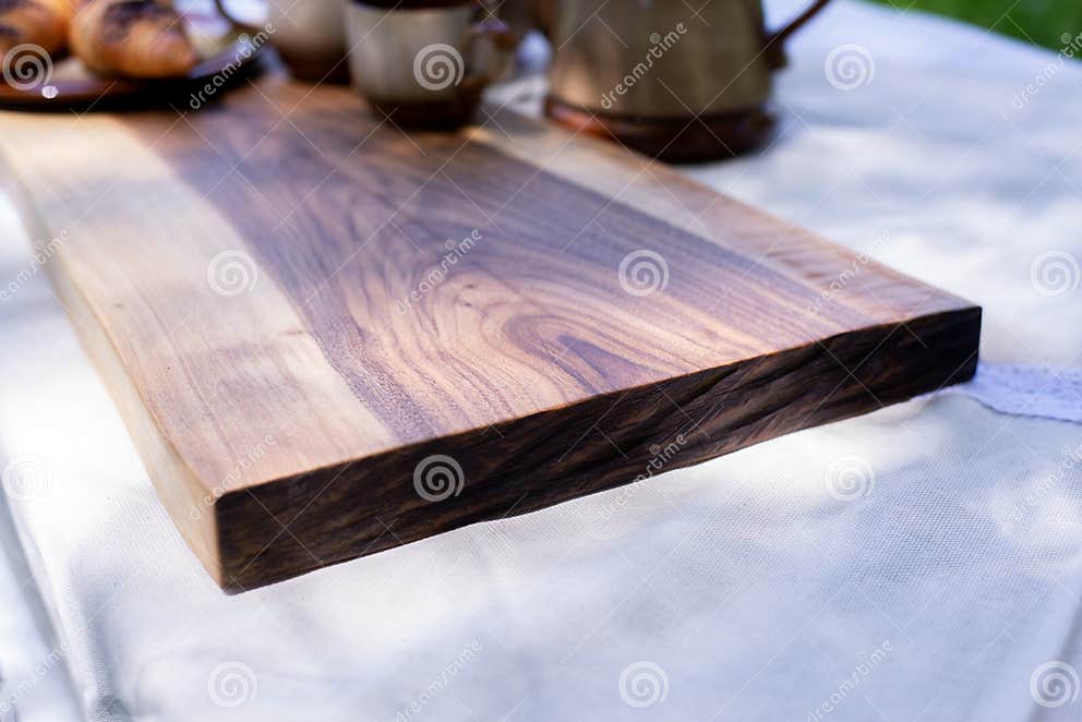 Wooden Kitchen Board on the Table. Walnut Kitchen Board Stock Image ...