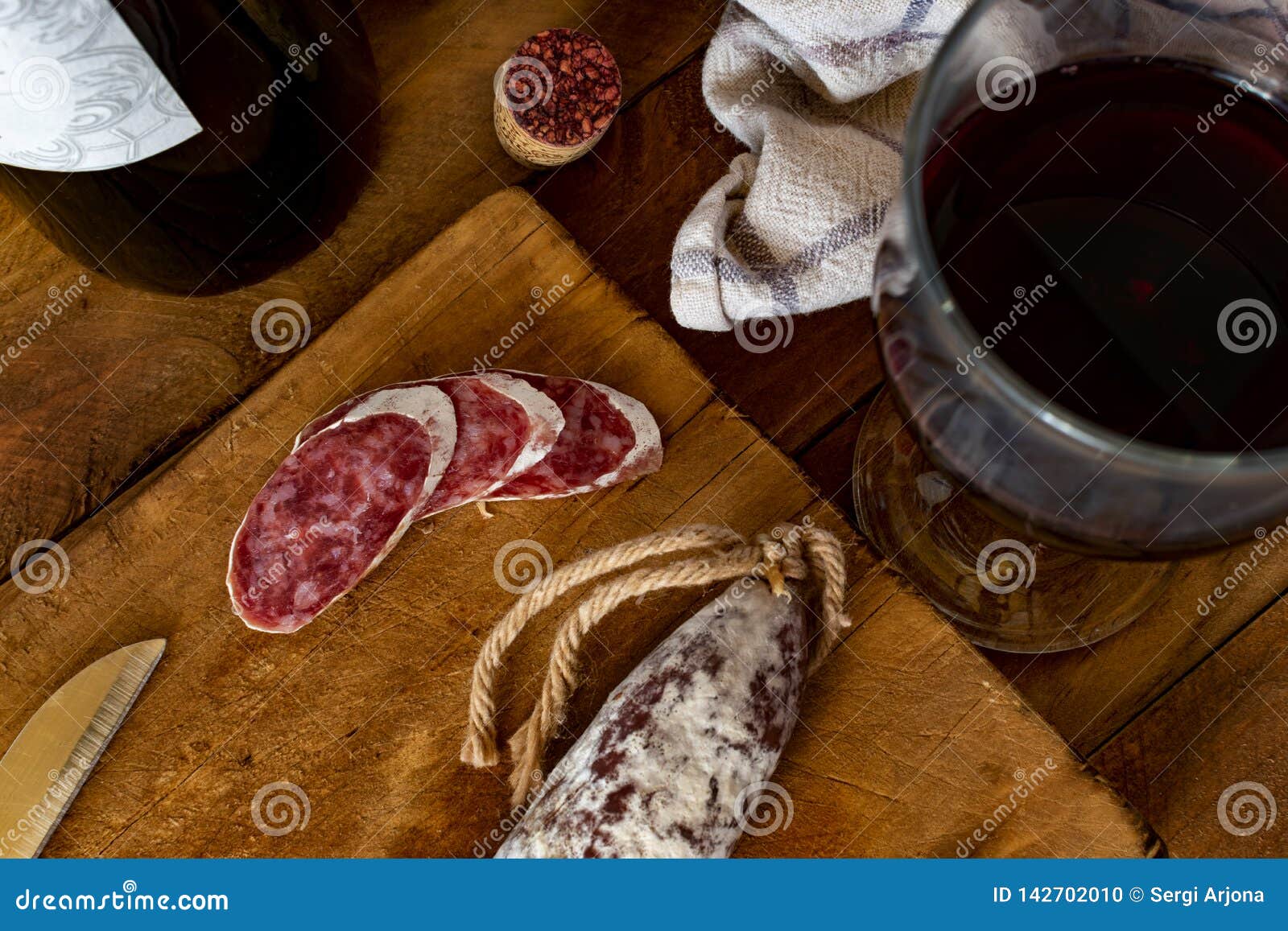 Wooden Kitchen Table with a Fuet Typical Catalan Sausage Stock Photo ...