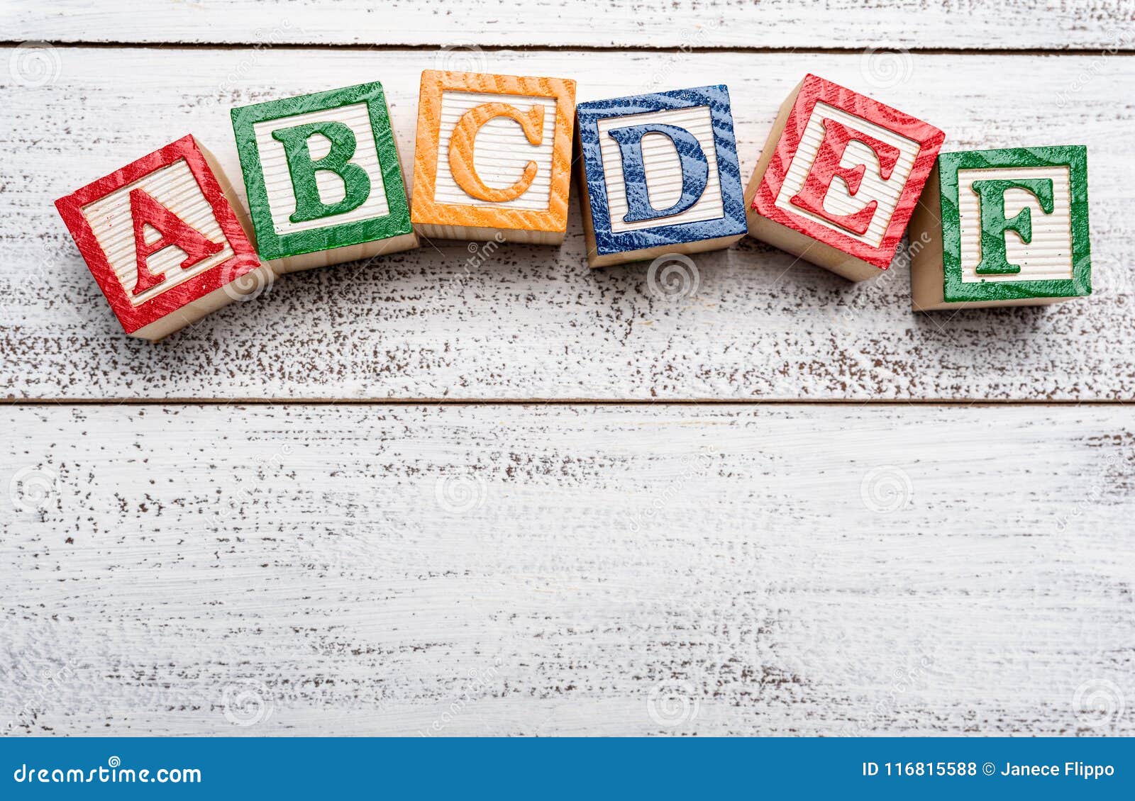 Wooden Letter Blocks Making The Alphabet On White Wood Background Stock ...