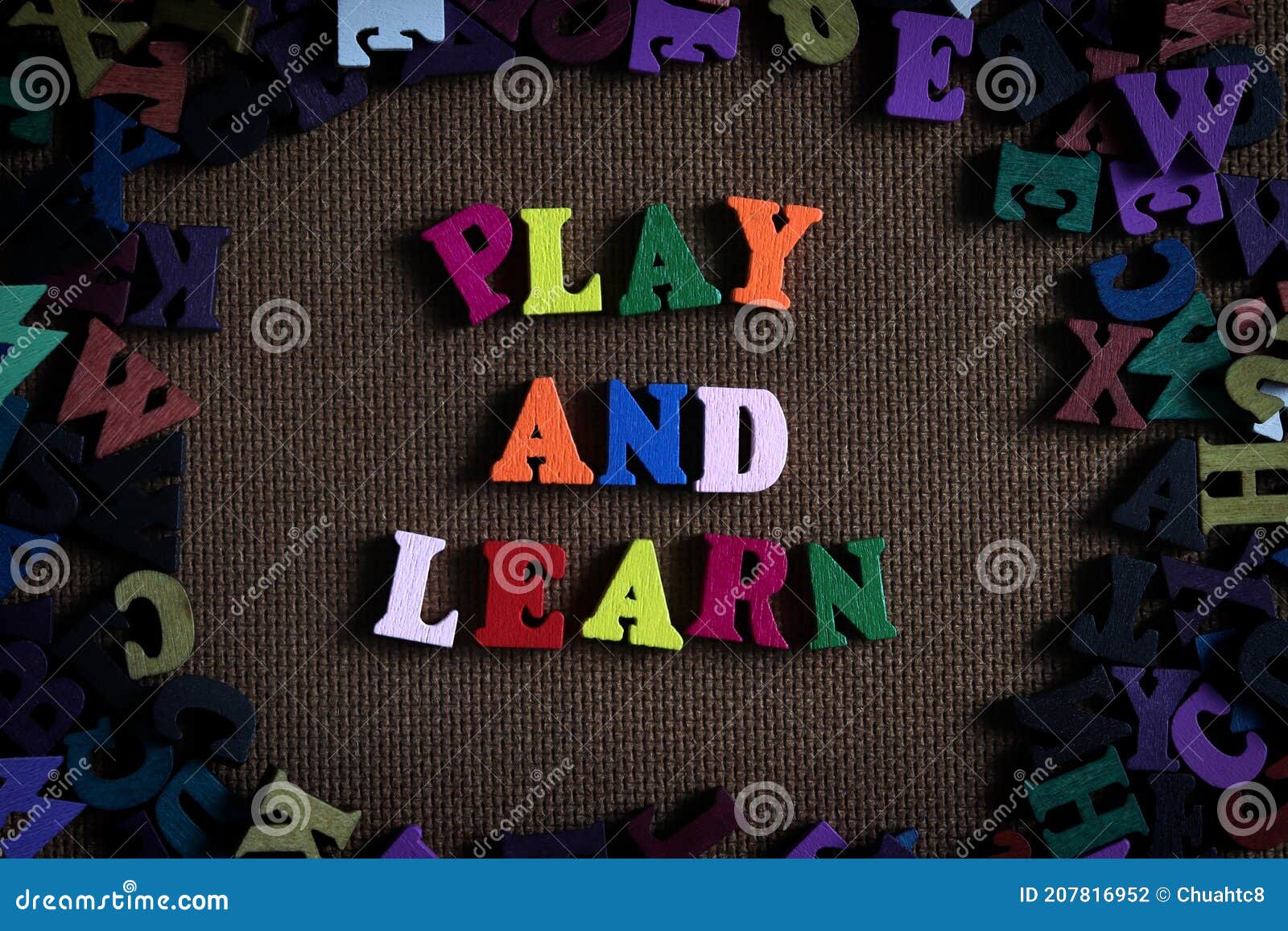 Wooden Letters Spelling `Play and Learn` Stock Photo - Image of games ...