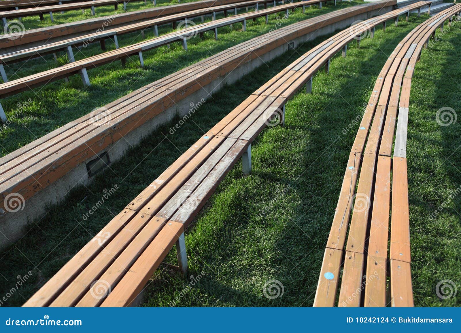 Wooden Long Seats in lines stock photo. Image of seat - 10242124
