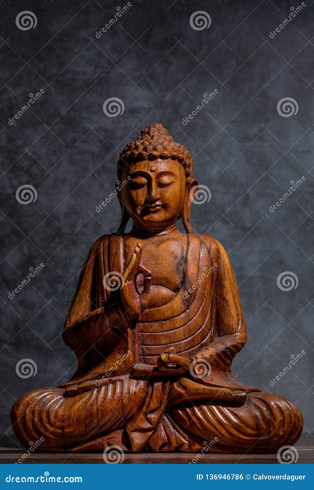 Wooden Made Buddha on a Grey Stone Background Stock Photo - Image of ...