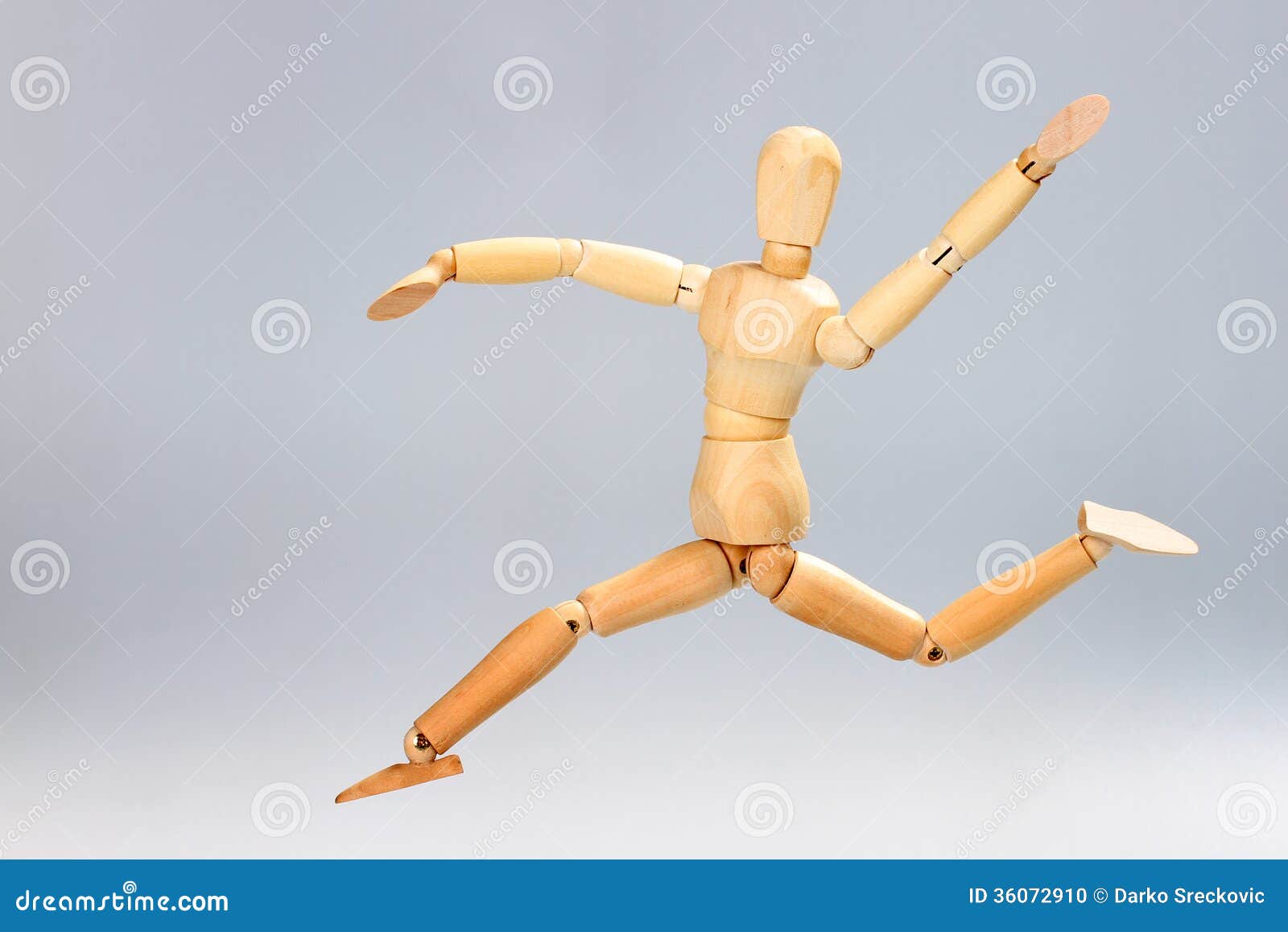 Wooden mannequin jumping stock photo. Image of model - 36072910