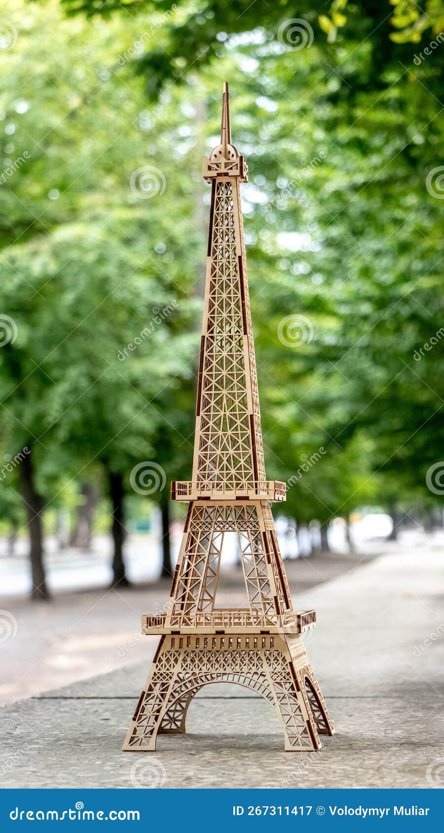 A Wooden Model of the Eiffel Tower in Paris Against the Background of ...