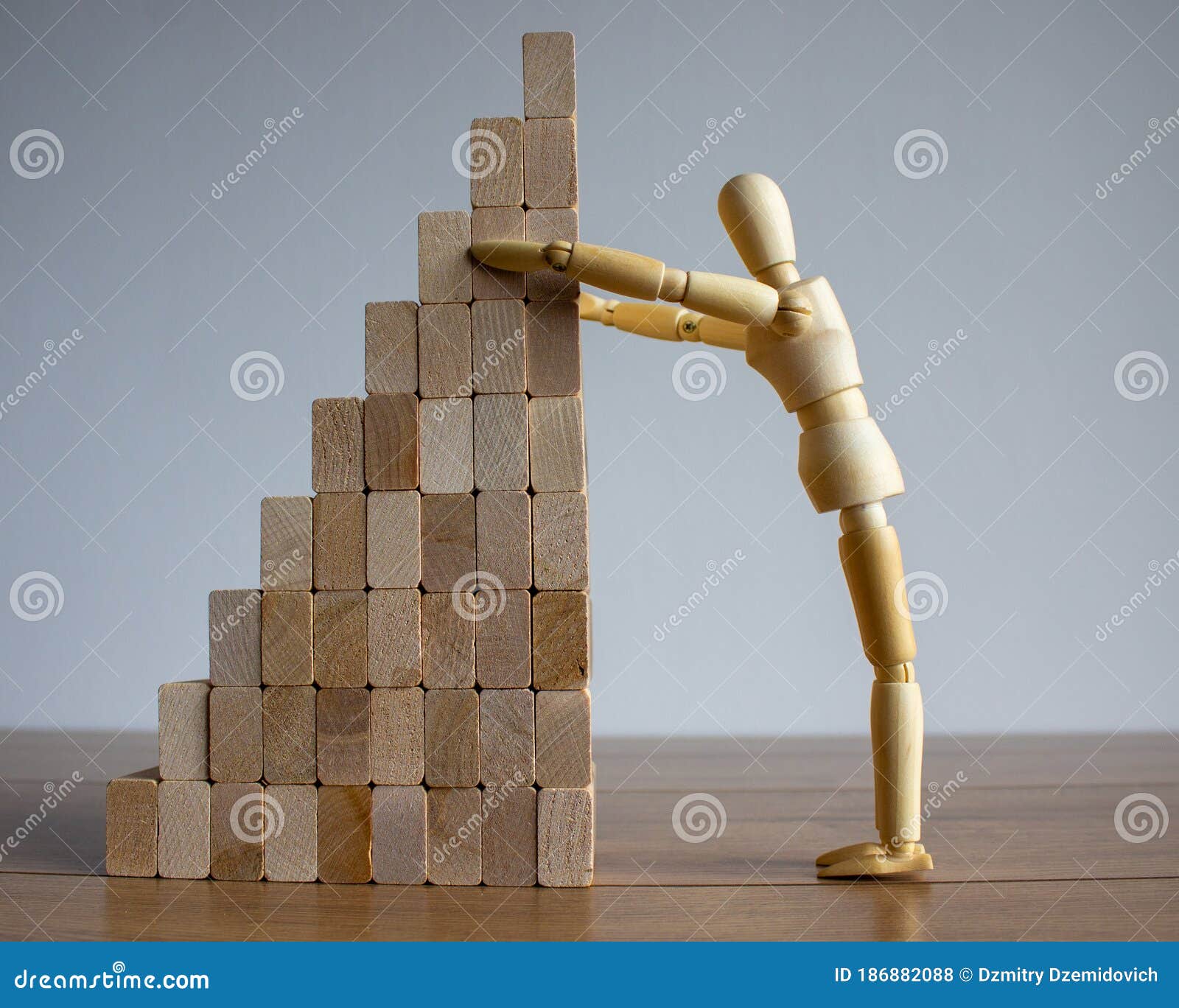 Wooden Model of Human Put Wooden Blocks on the Stack of Wooden Blocks ...