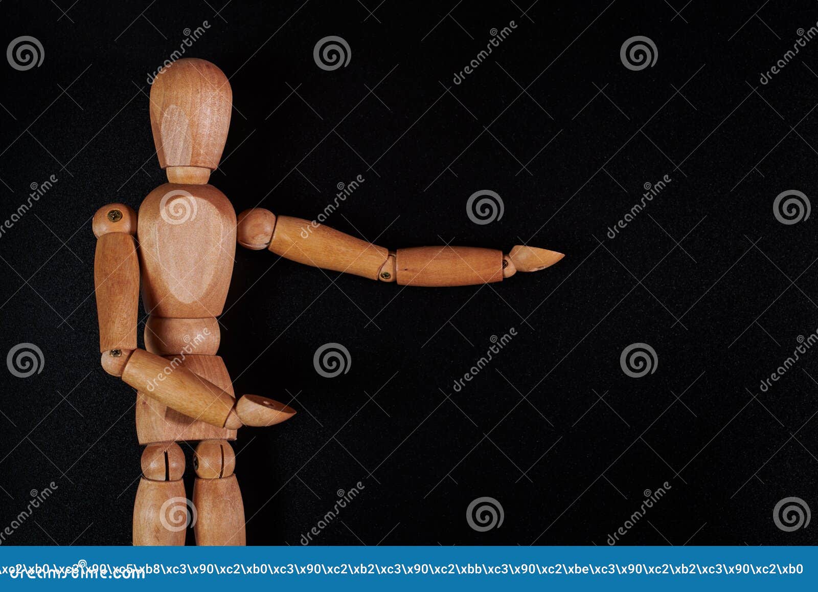 A Wooden Model Of A Man On A Black Background Shows His Wooden Hands To ...