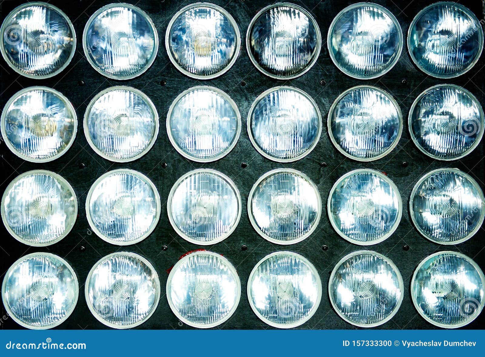 Panel with a Lot of Round Car Headlights Stock Photo - Image of ...