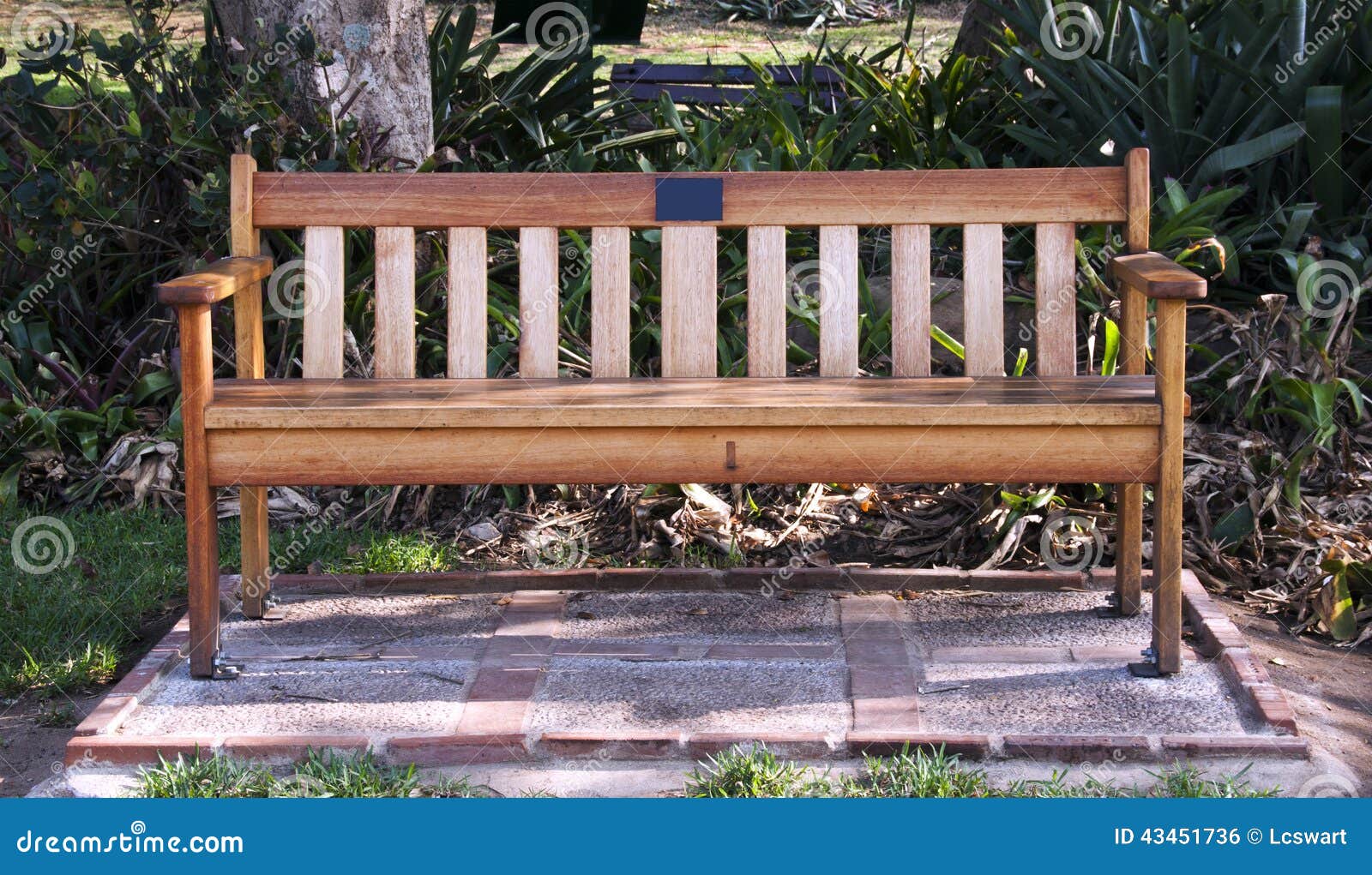 Wooden Park Bench in Shaded Garden Setting Stock Photo - Image of ...