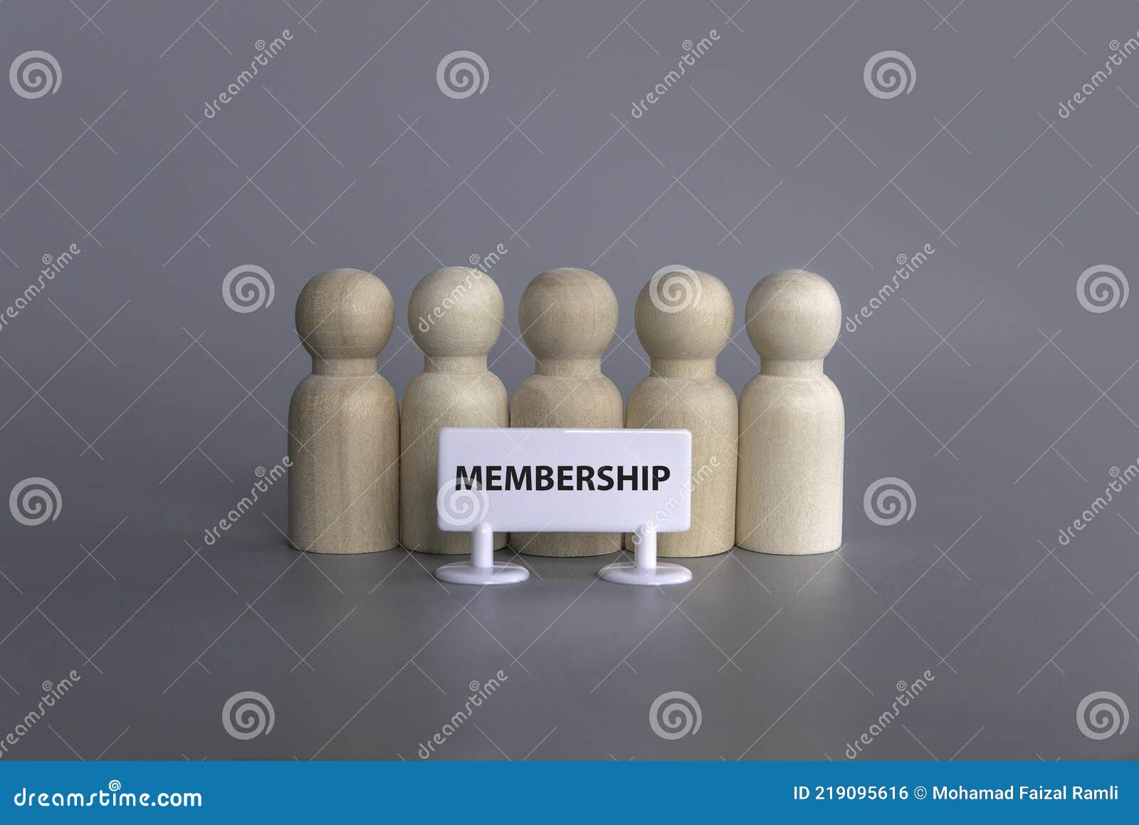 A Wooden People Standing in a Row with a Signboard of Membership Stock ...