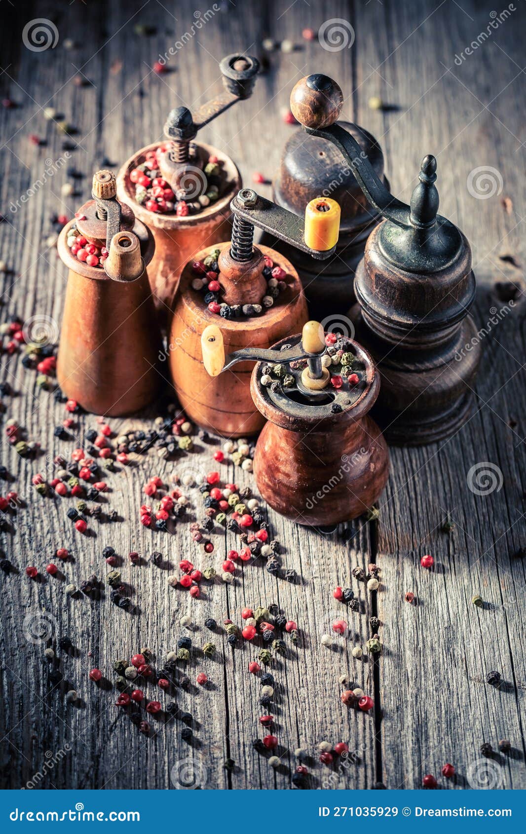 Wooden Pepper Mills with Different Types of Pepper on Table Stock Image ...