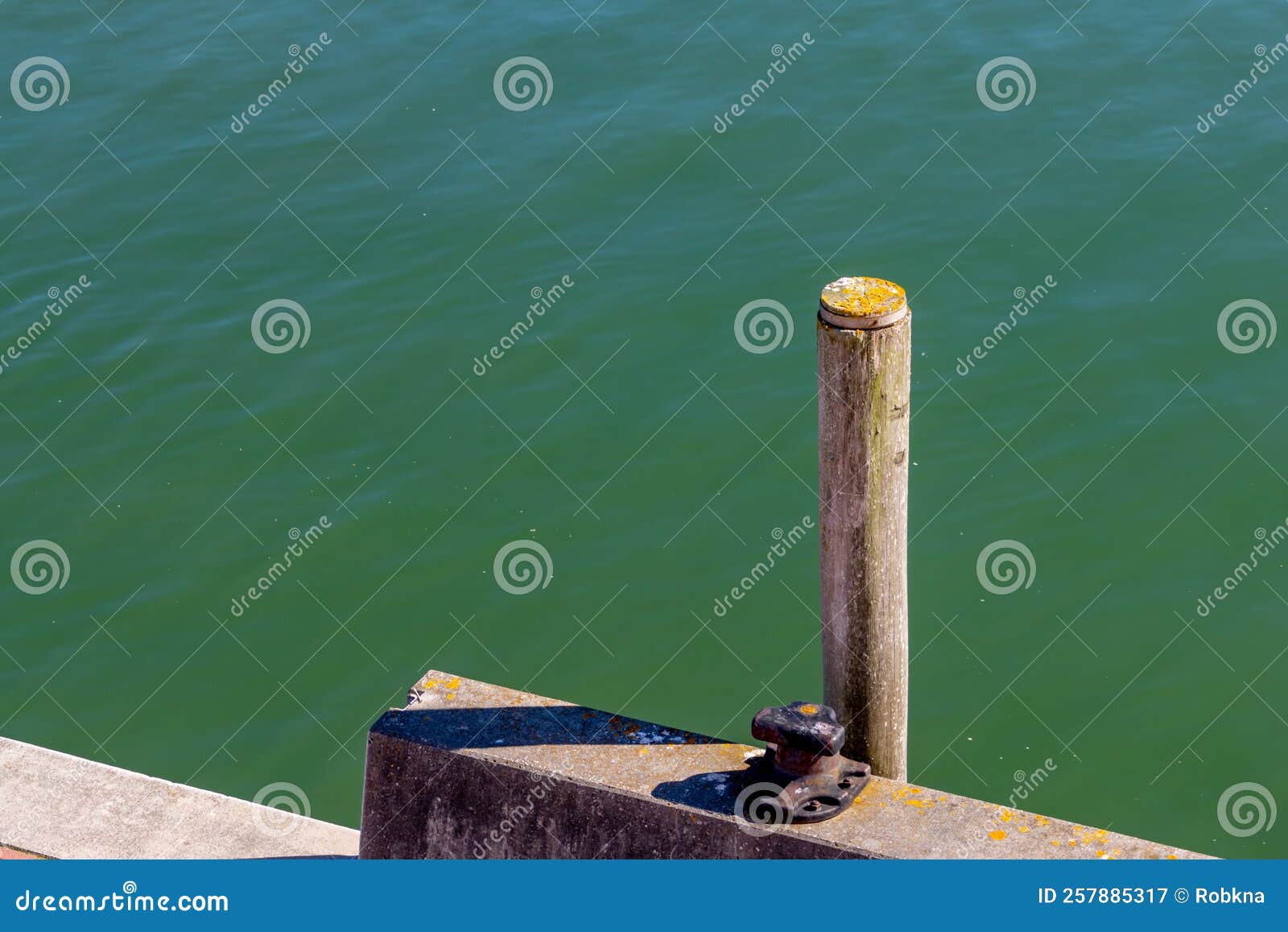Wooden Pillar or Mooring Post Along a Quay in a Harbor Stock Image ...