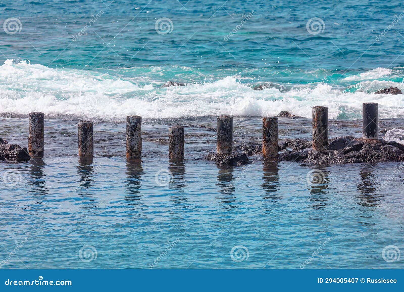 Wooden pillars breakwaters stock image. Image of seascape - 294005407