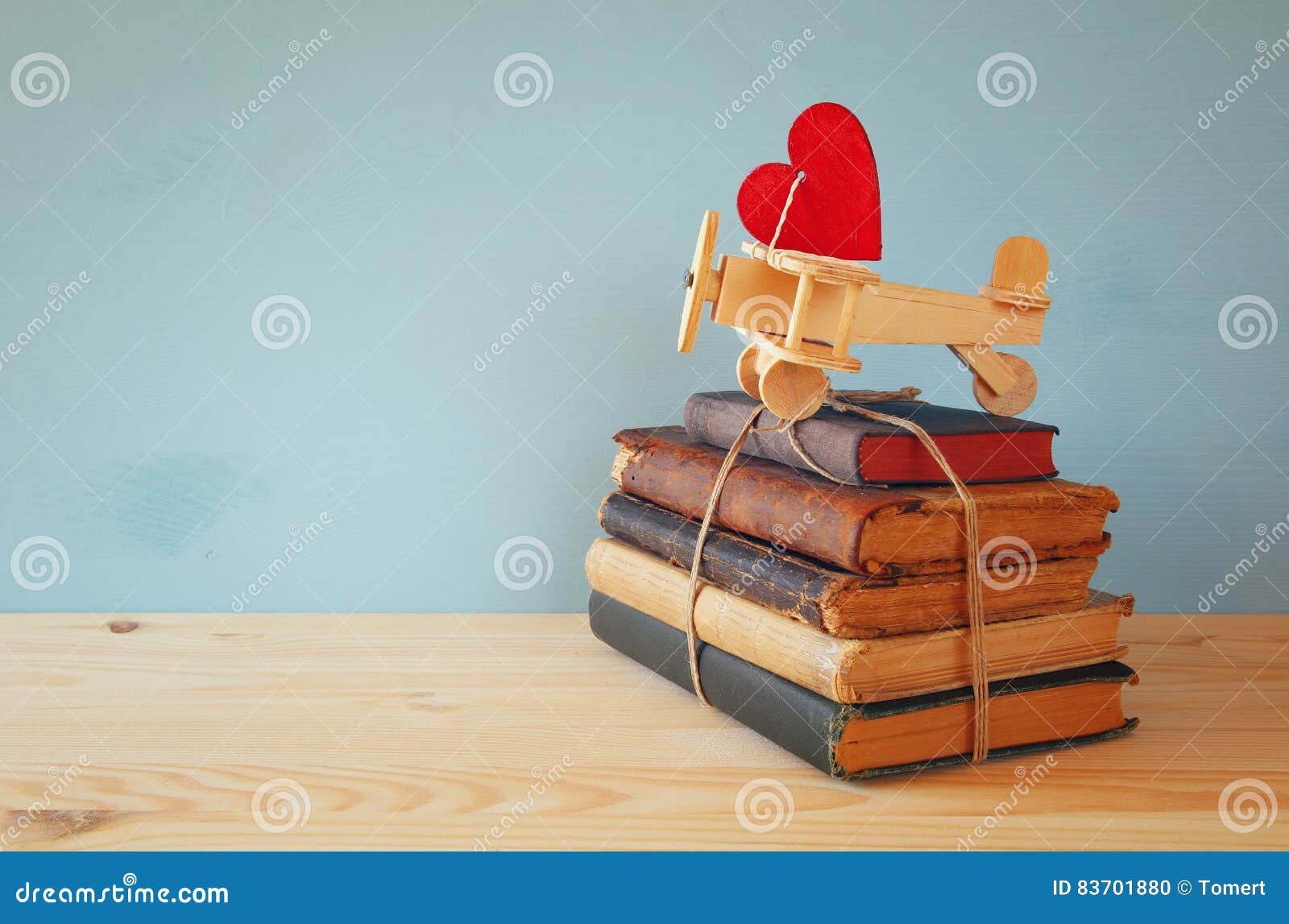 Wooden Plane with Heart on the Stack of Old Books Stock Photo - Image ...