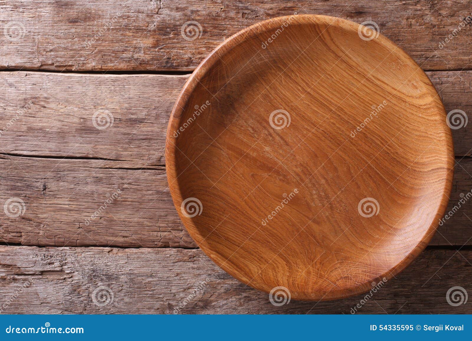 Wooden Plate on a Rustic Table Closeup. Horizontal Top View Stock Image ...