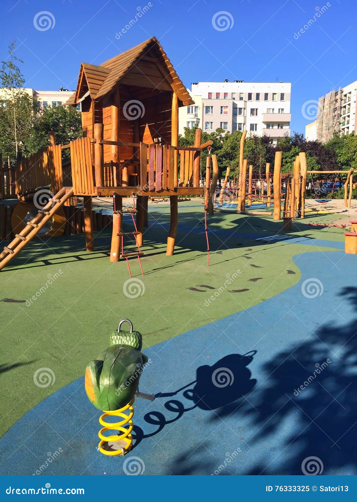 Wooden Playground With Swings, Slide And Stairs On The Background Of A ...