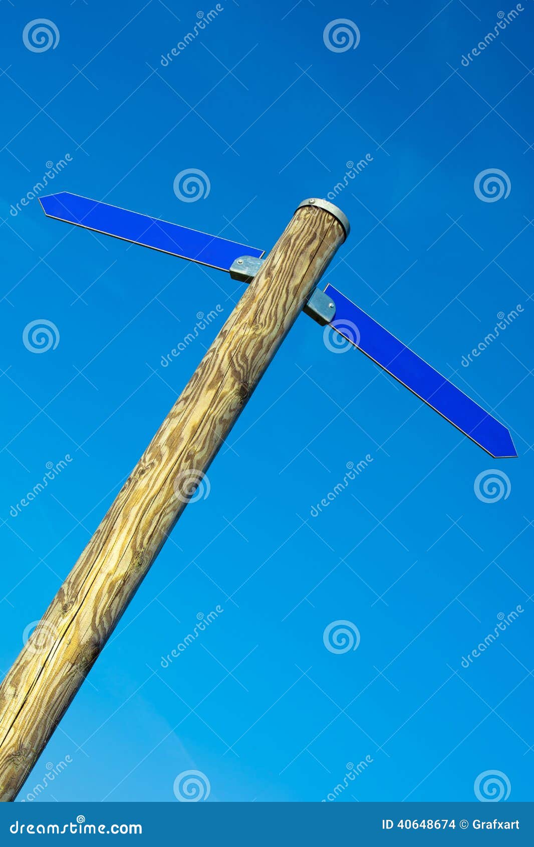 Wooden Pole with Blue Direction Arrows Stock Photo - Image of ...