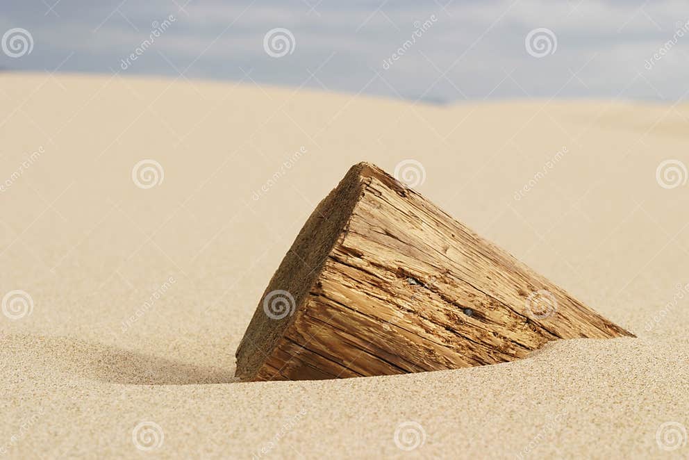 Wooden Pole Buried in Sand stock image. Image of terrain - 4170701