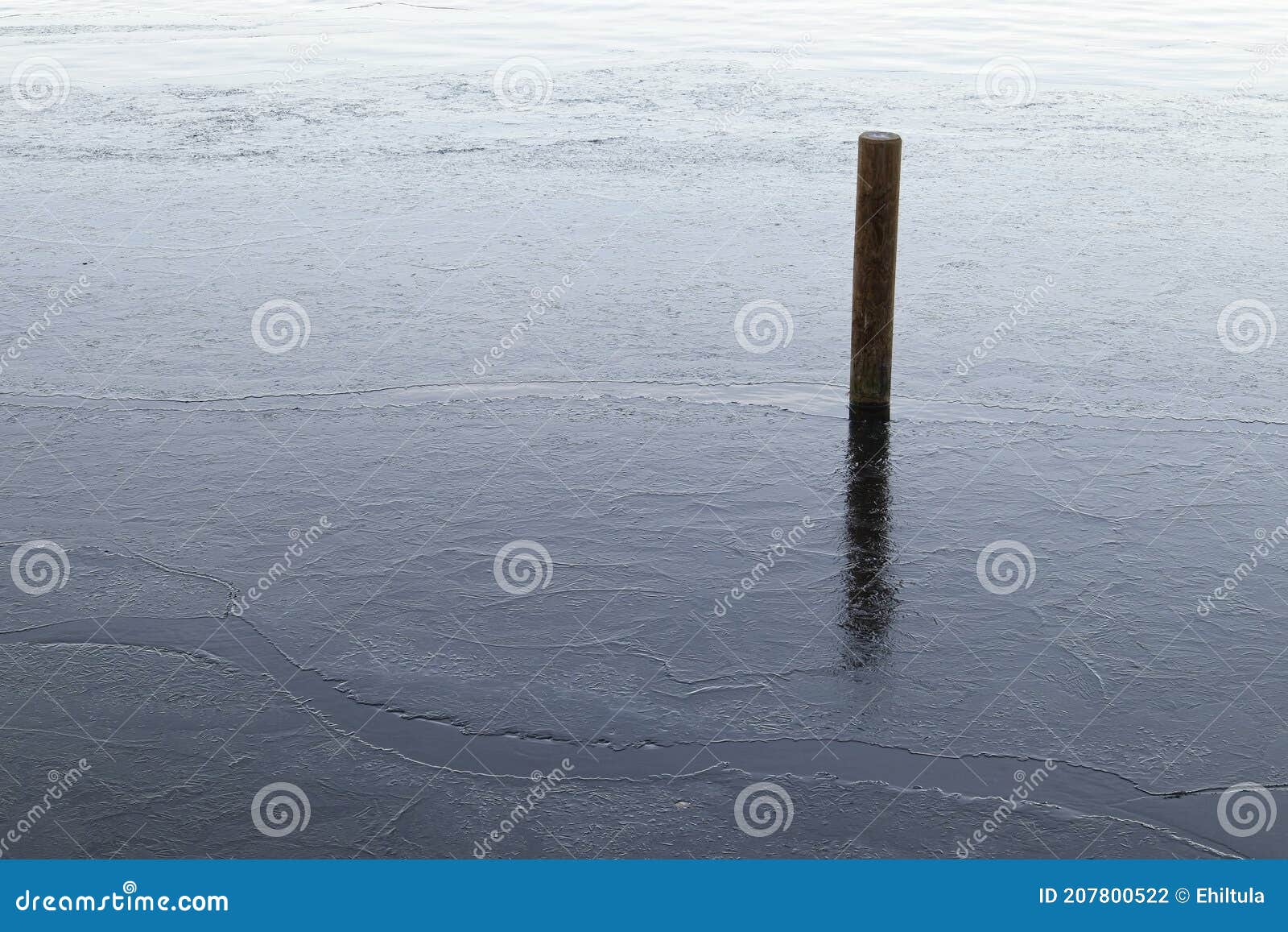 Wooden Pole in a Freezing Lake Stock Photo - Image of weather, people ...