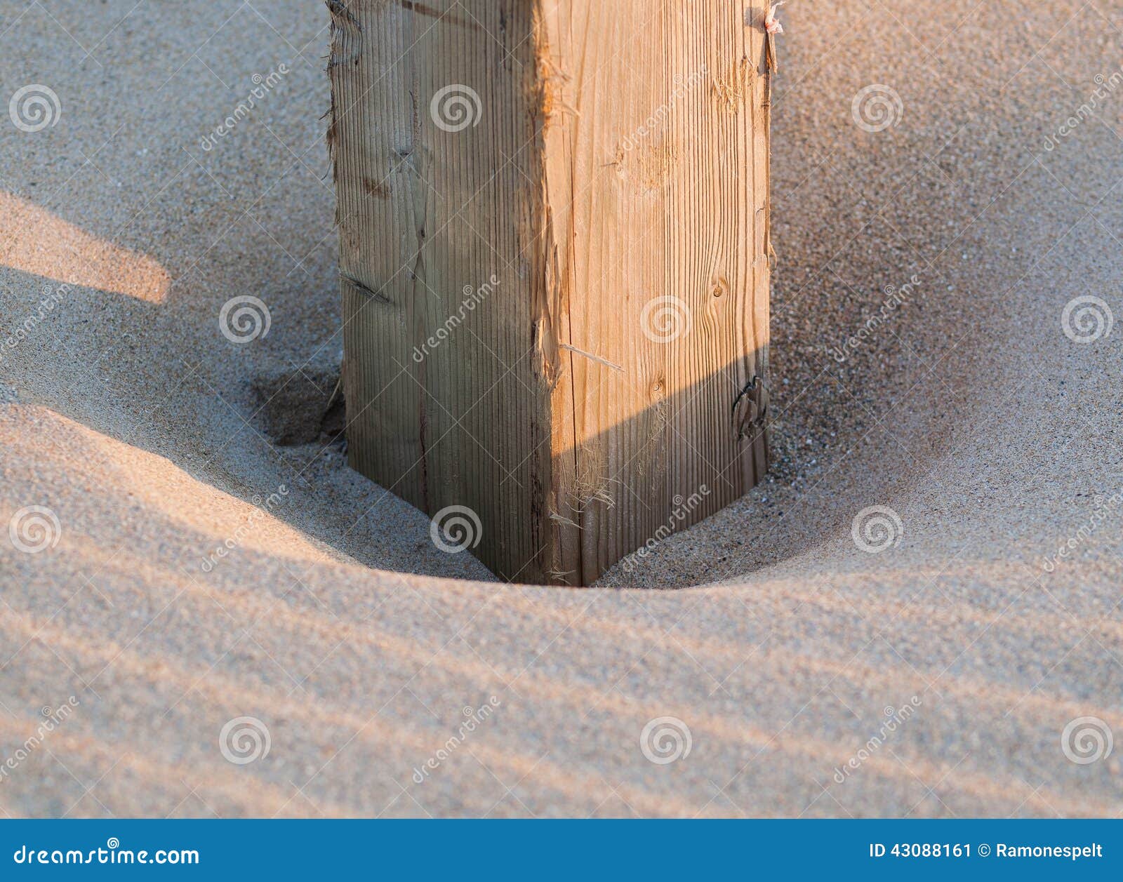 Wooden Post Buried in the Sand Stock Image - Image of buried, sunlight ...
