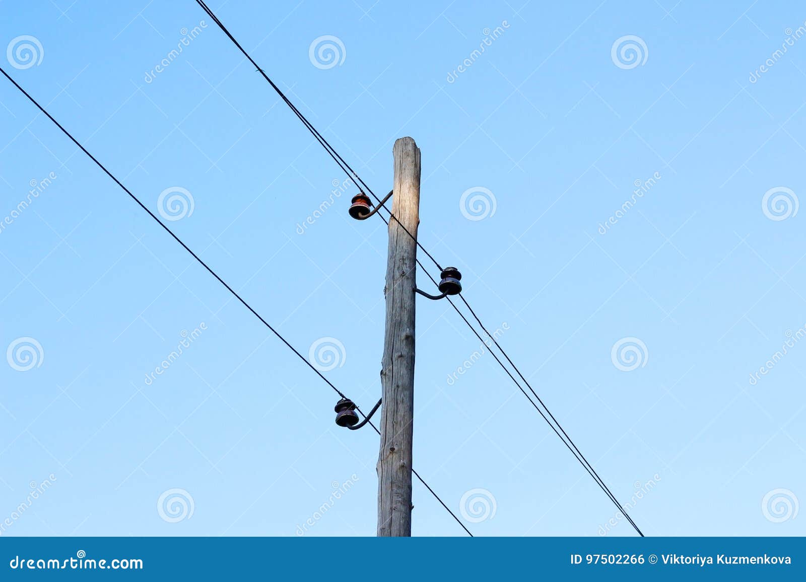 A Wooden Post with Wires Electricity. on the Background of Blue Stock ...