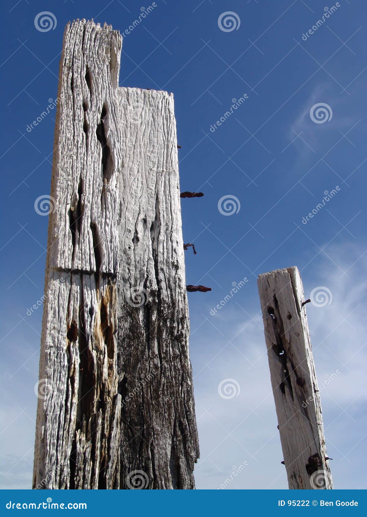 Wooden Posts stock photo. Image of nails, posts, rust, clouds - 95222