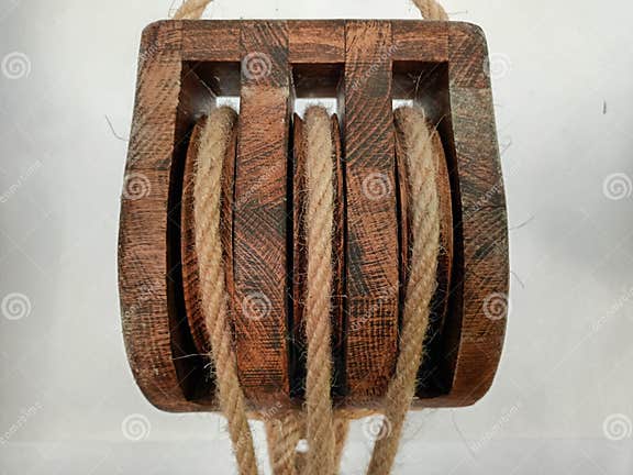 Wooden pulley with a rope editorial image. Image of artistic - 319756830