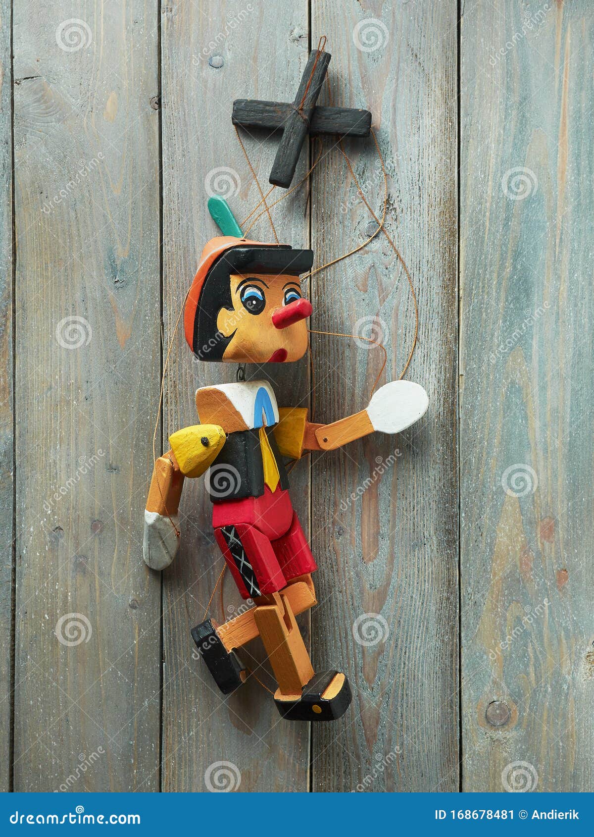A Wooden Puppets Walk Sideways Against a Rustic Wooden Background ...