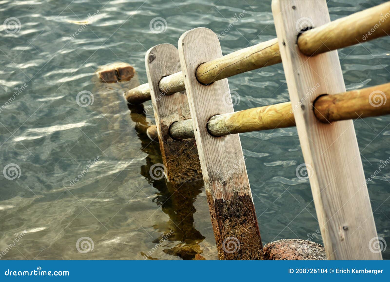 Wooden Rail Leading into Water Stock Photo - Image of nature, outdoors ...