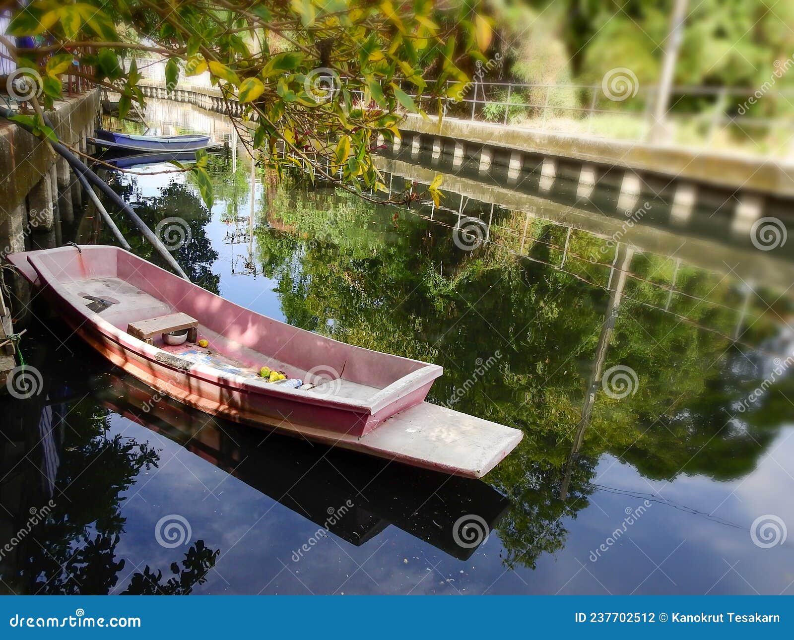 Wooden Red Boat in Small Csbsl with Reflection of Tree in Clear Water ...