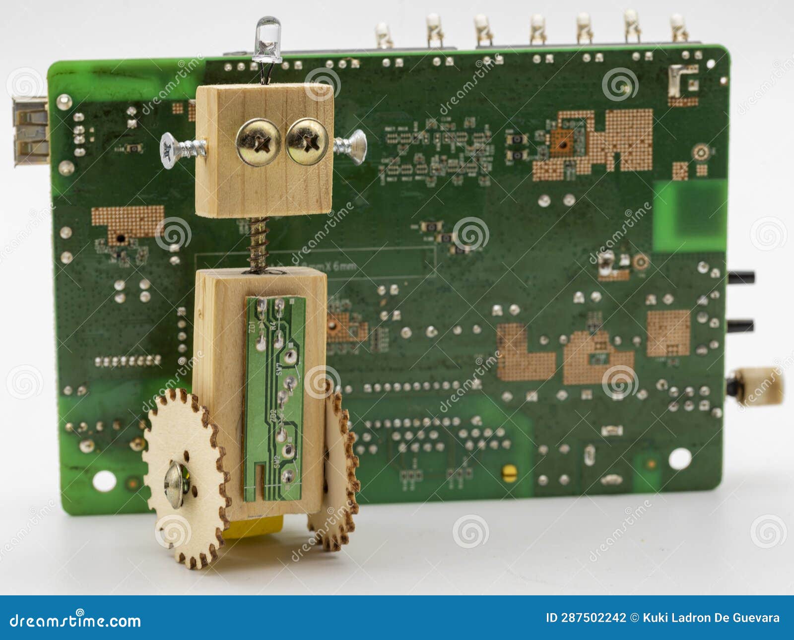 Wooden Robot in Front of an Electronic Circuit Panel Stock Photo ...