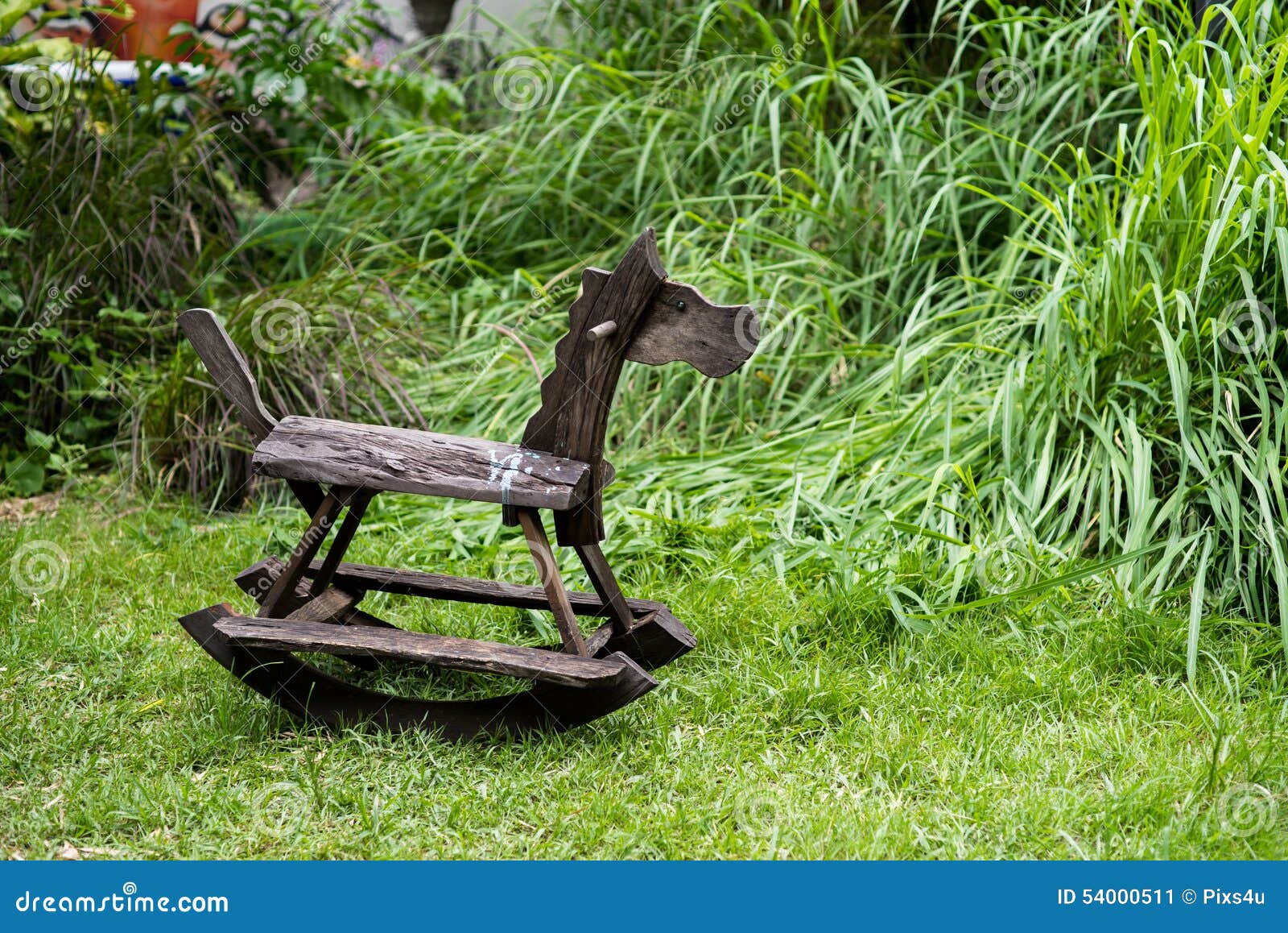 Wooden Rocking Toy on Yard Garden Stock Image - Image of toddler, play ...