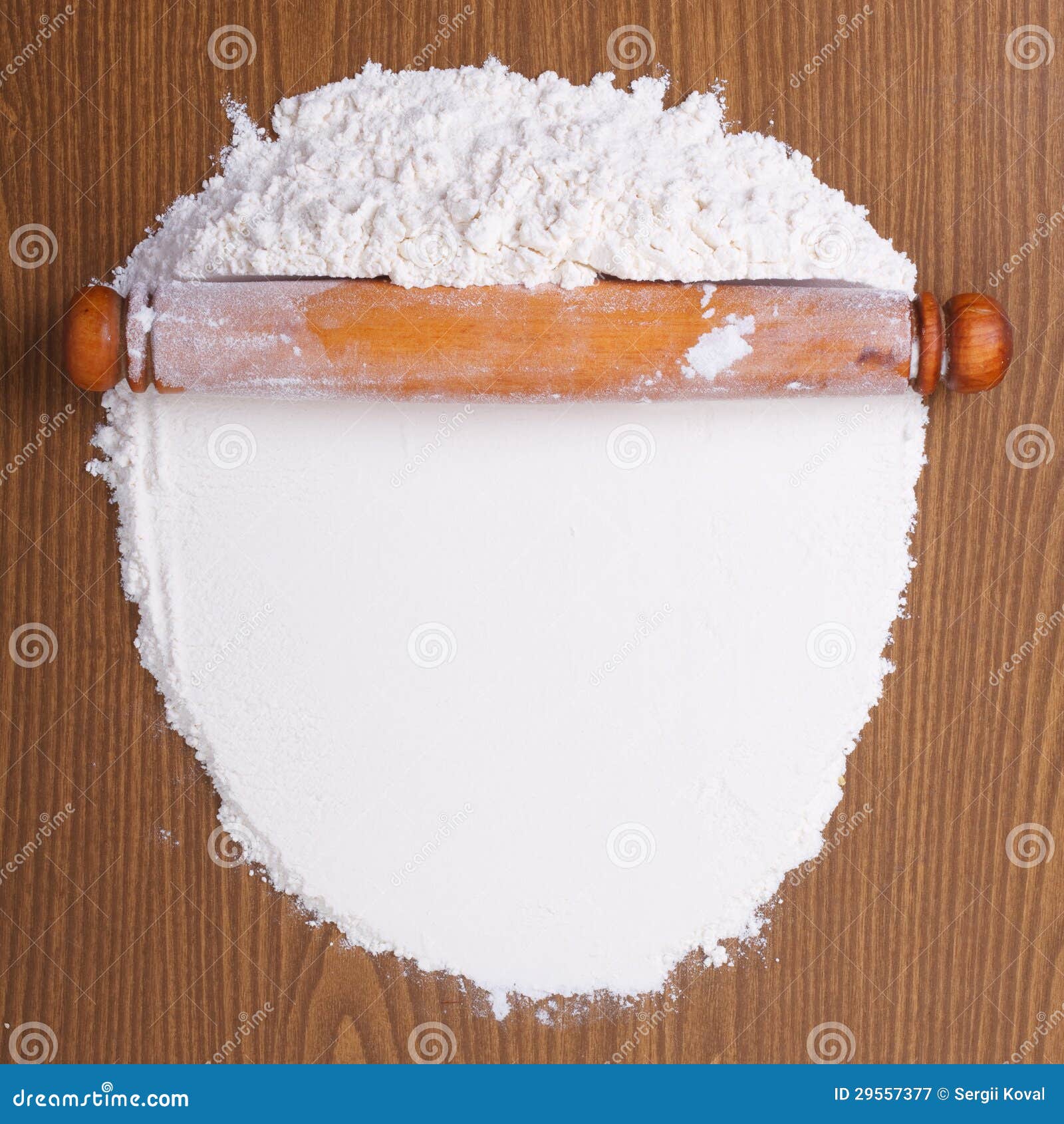 Wooden Rolling Pin with White Wheat Flour on the Table Stock Image ...