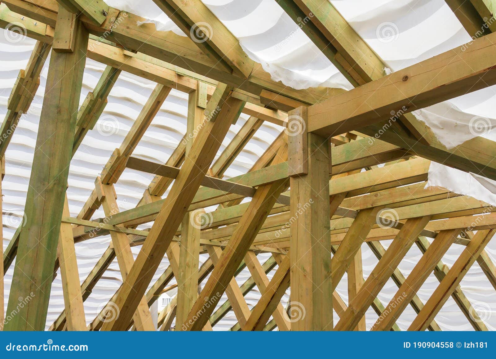 Wooden House Frame. Roof Support Beams in Home Under Construction Stock ...